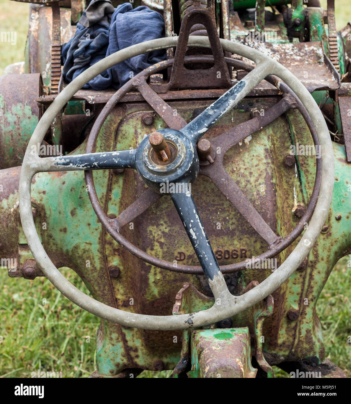 Two old vintage tractor steel sterring wheels Stock Photo - Alamy