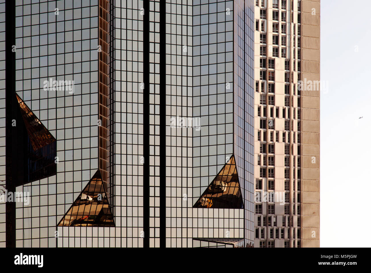 A close up shot of a modern glass building skyscraper and its ...