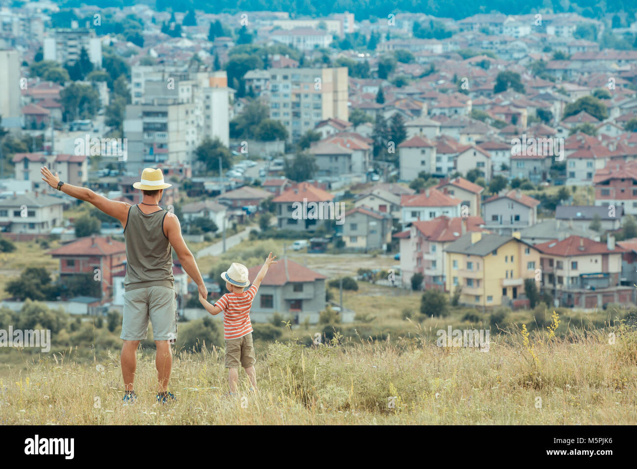 A young man is walking with a child Stock Photo - Alamy