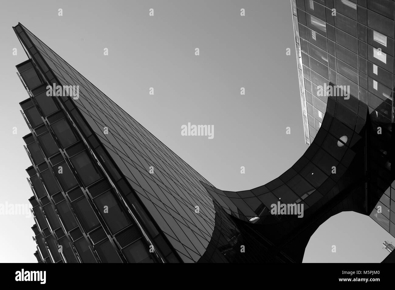 A view of an architecture modern geometric glass building in London, UK ...