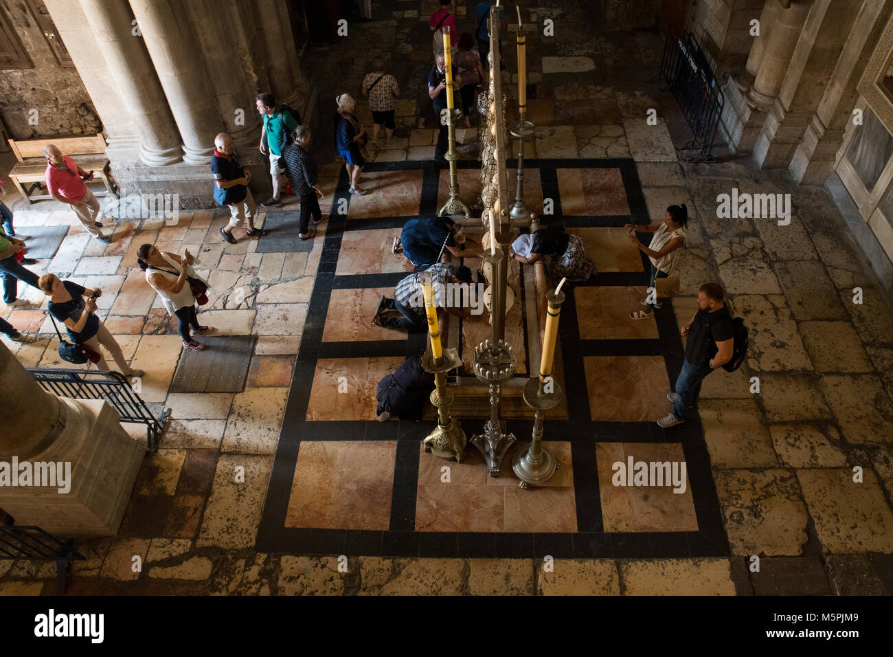 People worshiping the Stone of Anointing at the Church of the Holy ...