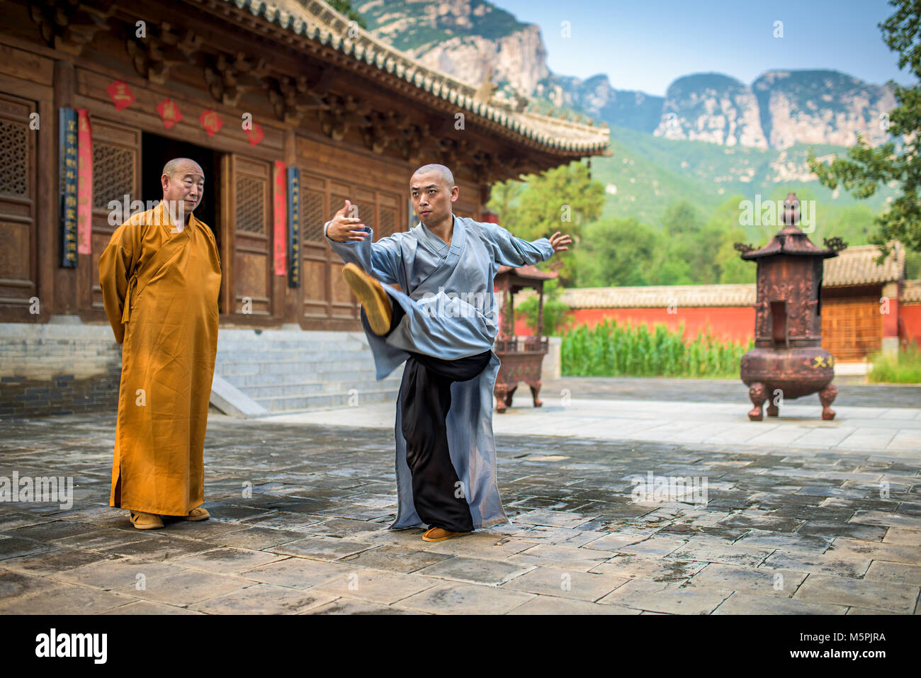Shaolin monk in training with his teacher Stock Photo - Alamy