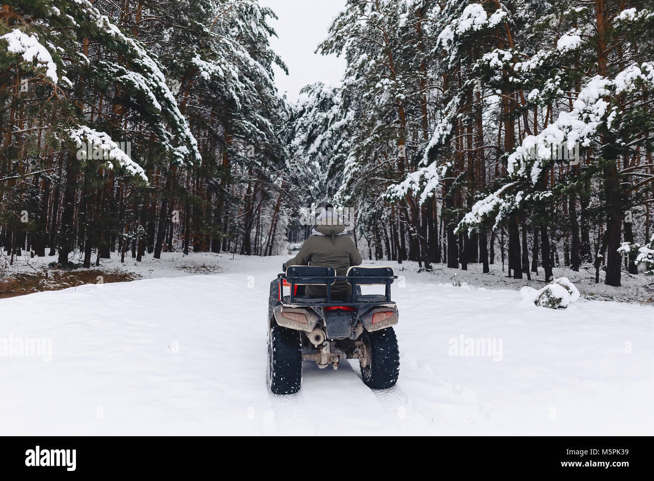 Guy rides motorcycle in snowy hi-res stock photography and images - Alamy