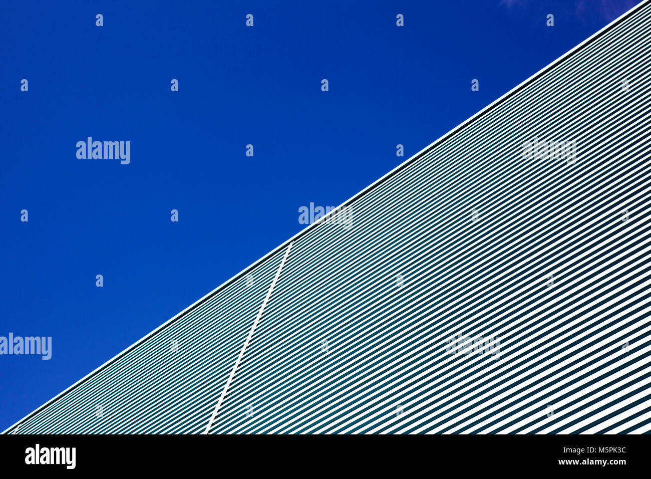 A diagonal view of a metal building Stock Photo - Alamy