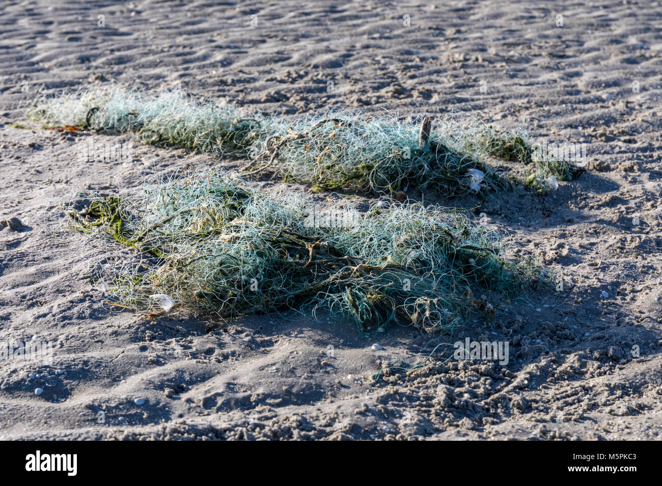 Fishing net on sand beach; Frederikshavn, Denmark Stock Photo - Alamy