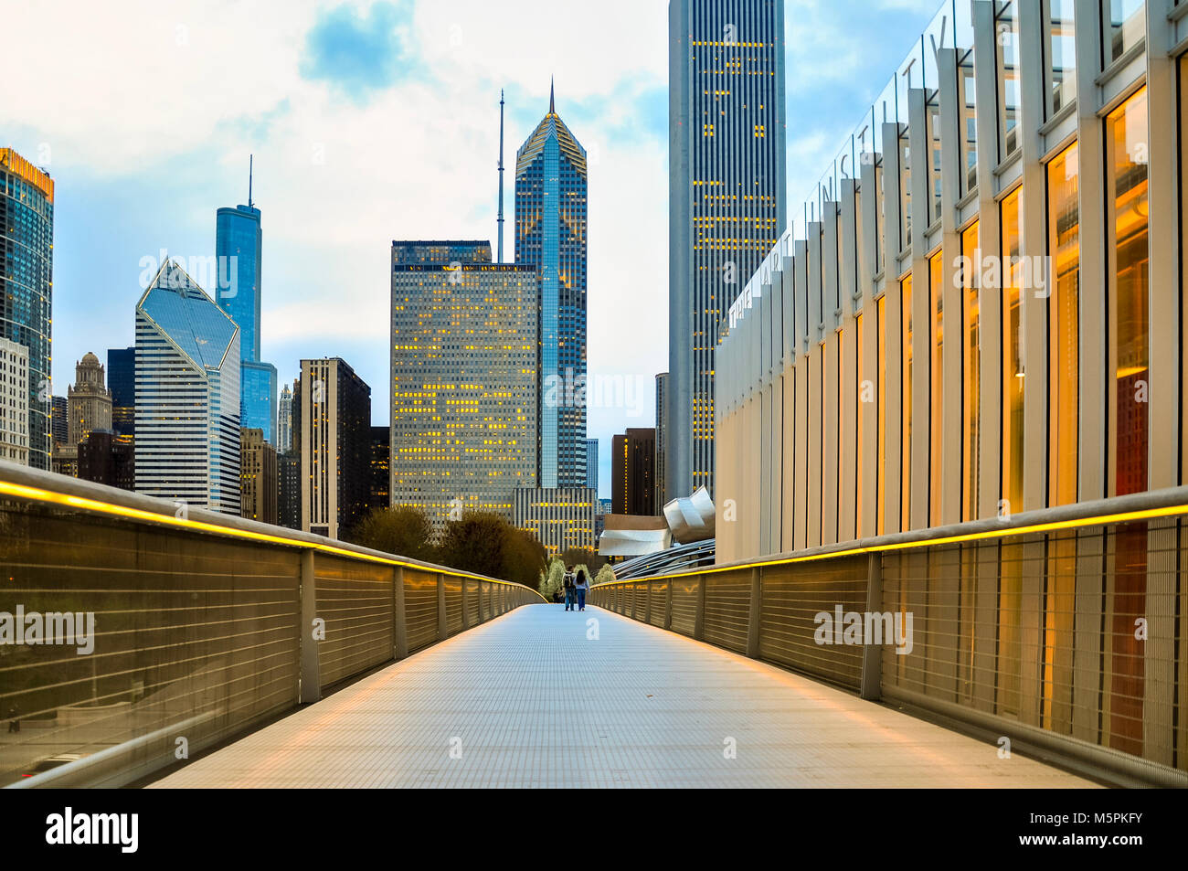 Chicago downtown skyline in the evening seen from pedestrian bridge ...
