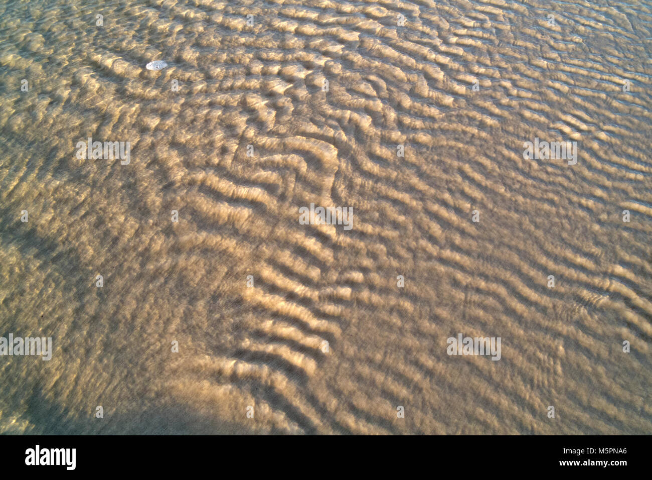 Water and sand ripples on the beach at Orange Beach, Alabama Stock ...