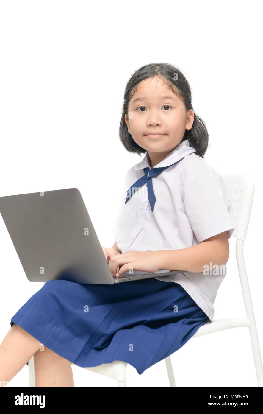 cute asian student playing computer laptop on white chair isolated on ...