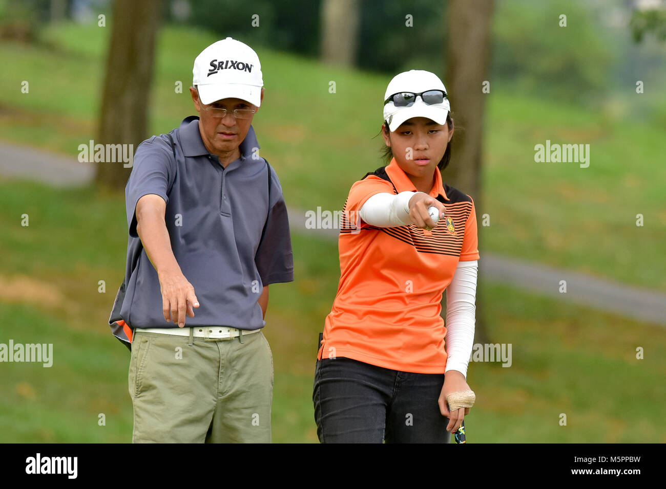 Danau, UKM Bangi - FEBRUARY 11: Grace Chin Jun Li lines up her putt on ...