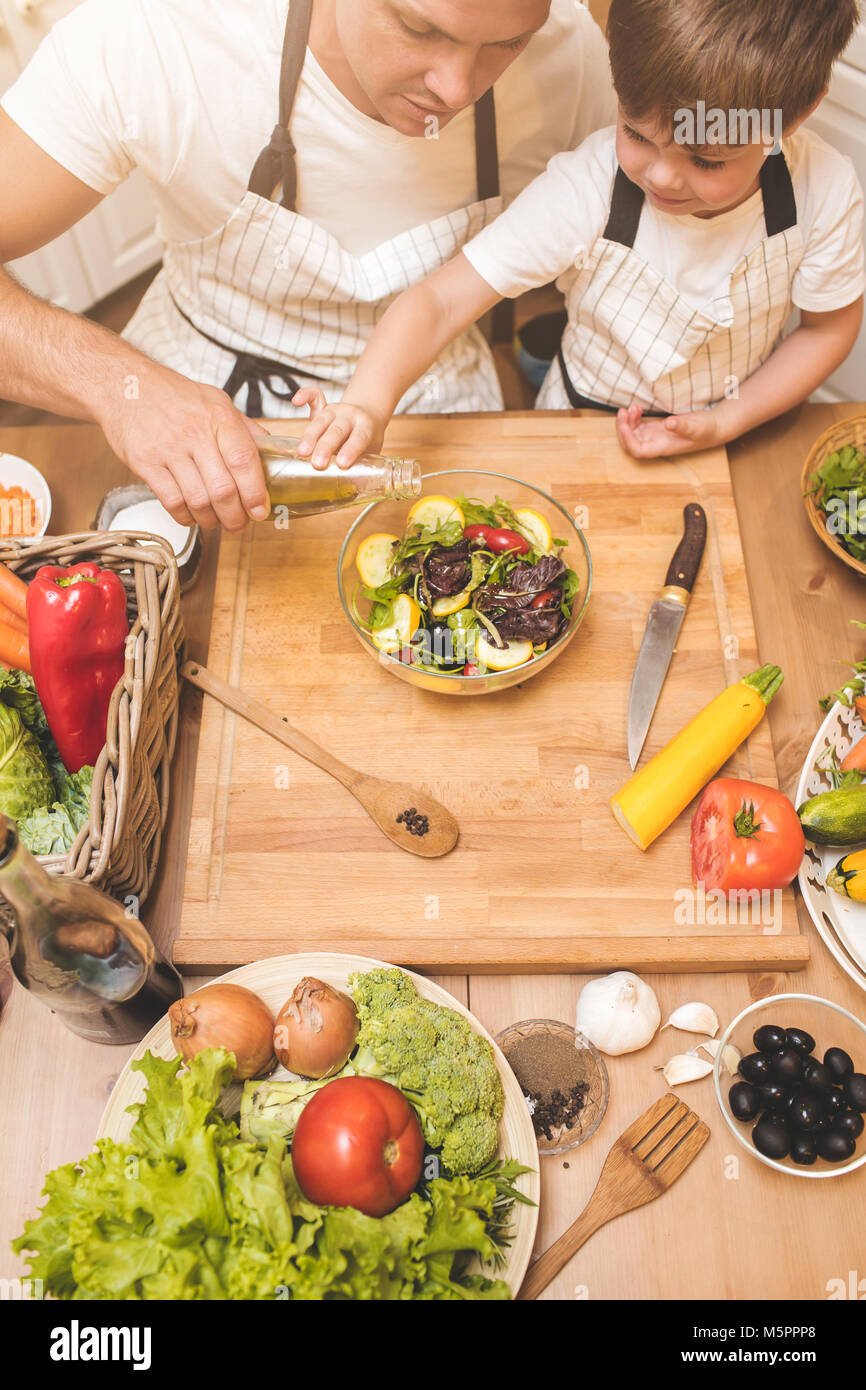 Father is cooking with his son Stock Photo - Alamy