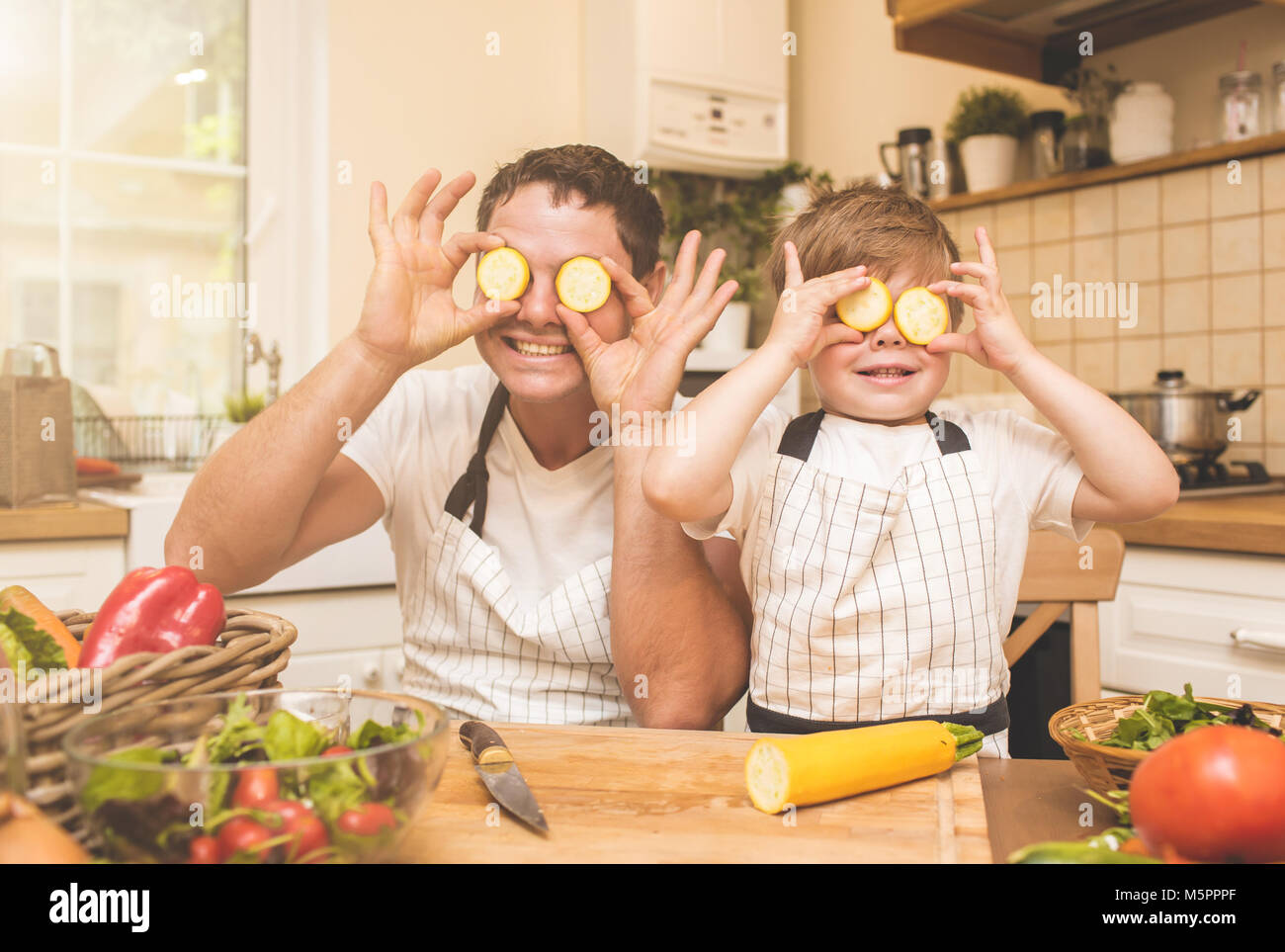Father is cooking with his son Stock Photo - Alamy