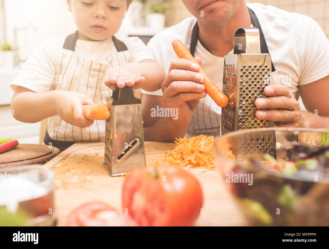 Father is cooking with his son Stock Photo - Alamy