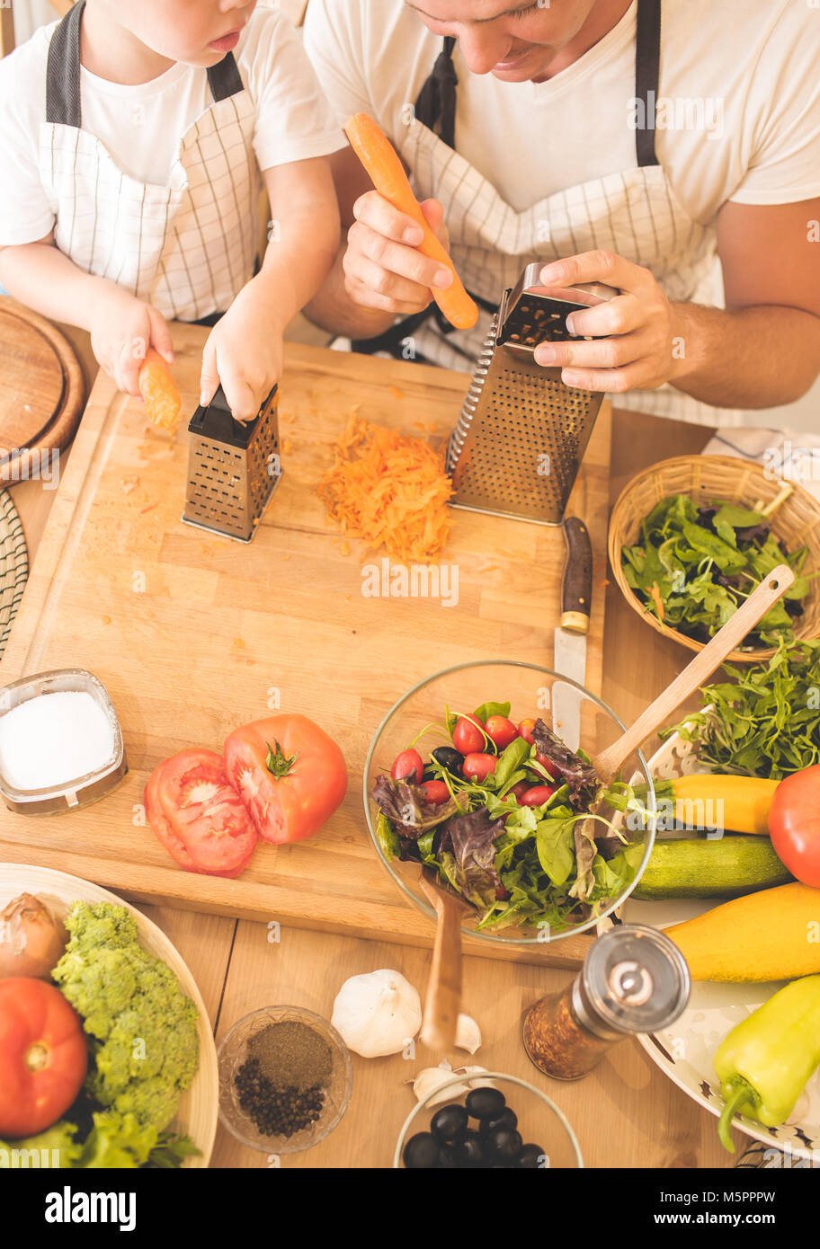 Boy cooking dinner hi-res stock photography and images - Alamy