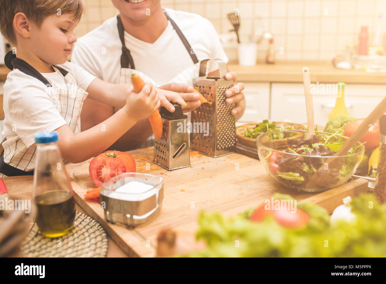 Father is cooking with his son Stock Photo - Alamy