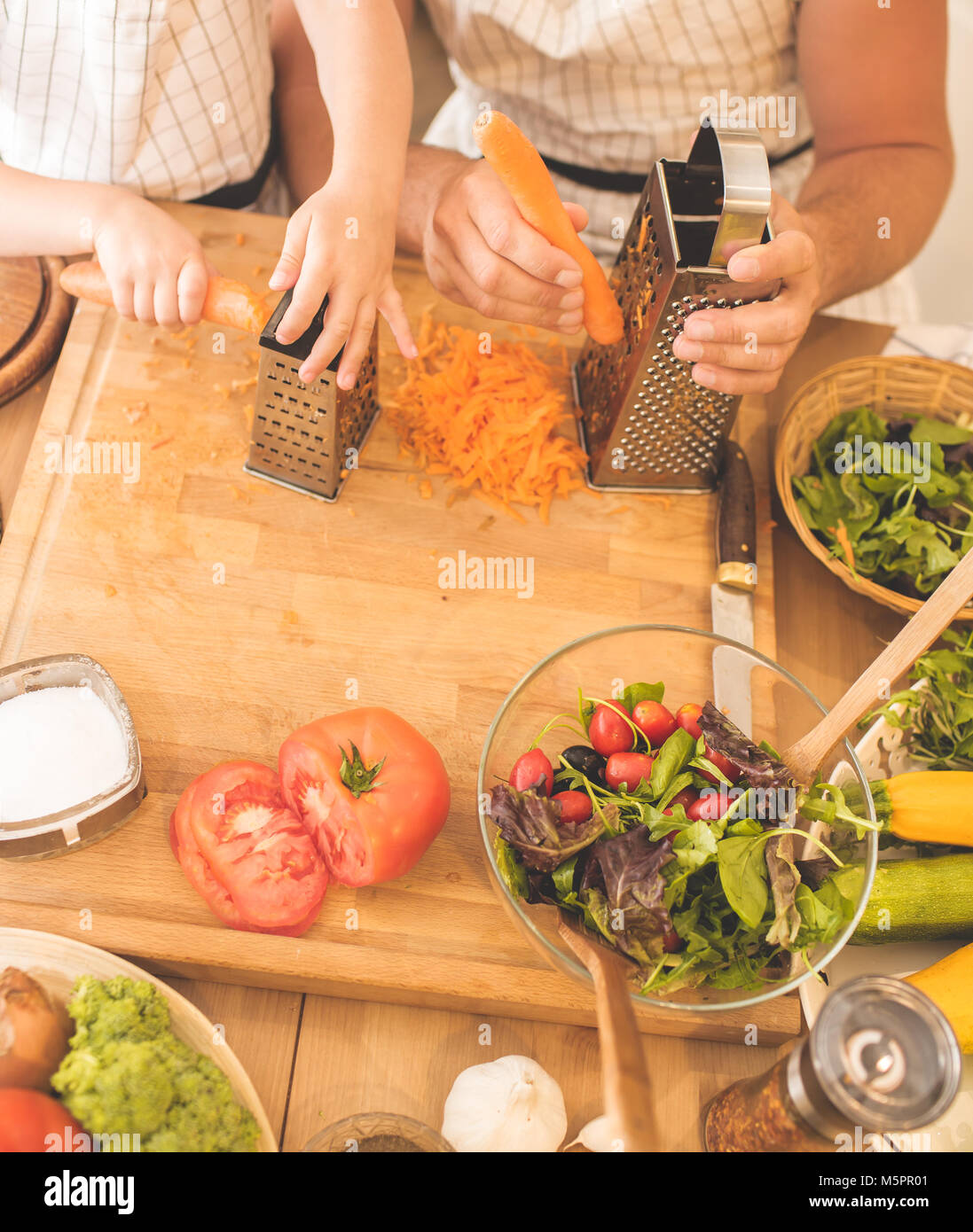 Father is cooking with his son Stock Photo - Alamy