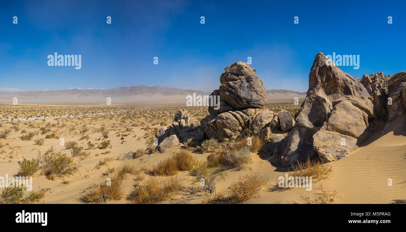 Rock stone formations in the drifted sand of a panoramic stretch of ...