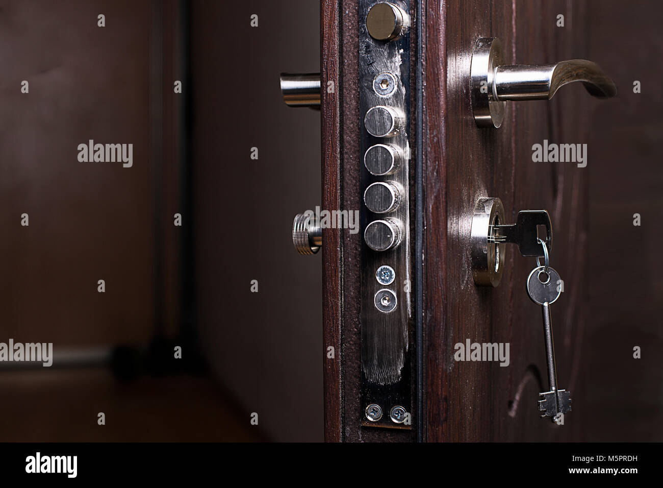 lock from the entrance door with a key inside Stock Photo - Alamy