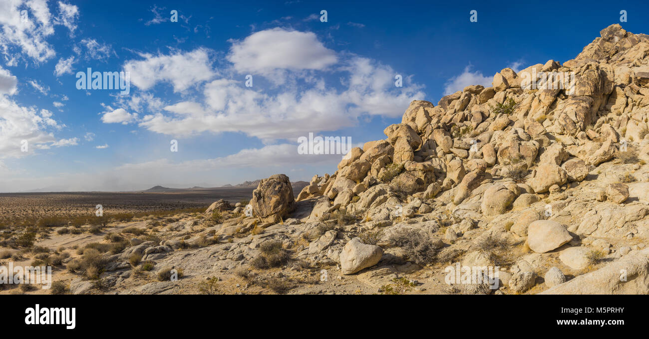 Hill composed of large sandstone boulders piled high in the sandy ...