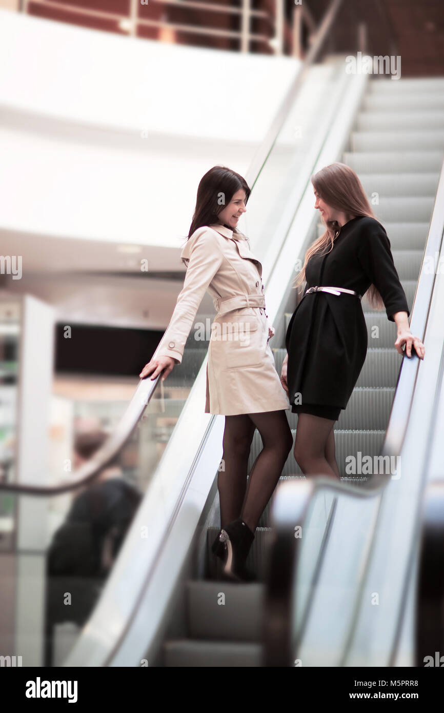 Employees of the company standing on the stairs in the lobby of the ...