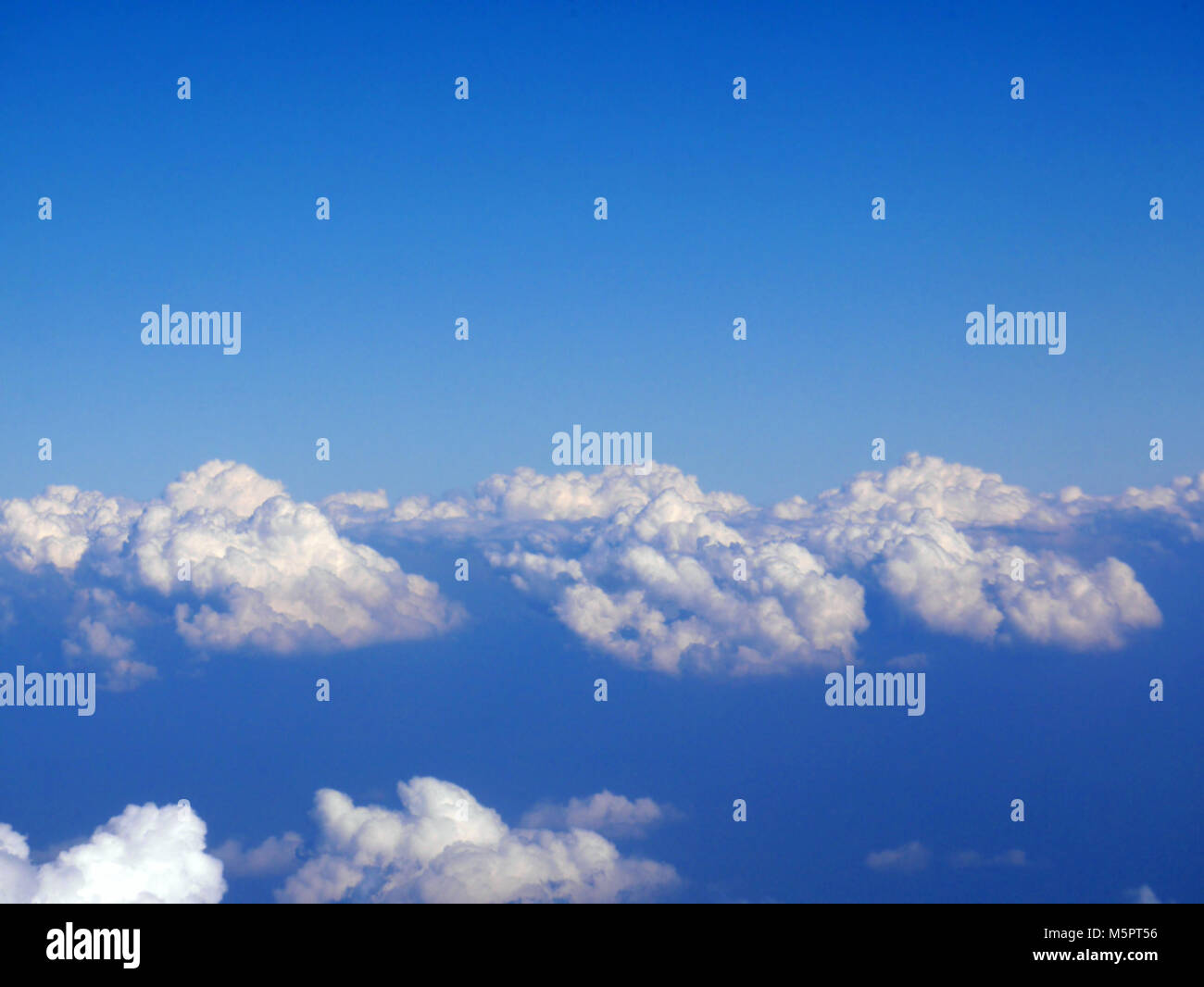 Groups of clouds in aerial view on blue sky Stock Photo - Alamy