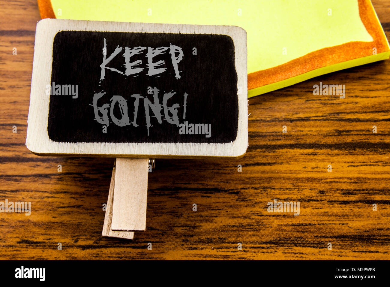Handwritten text showing Keep Going. Business concept for Go Moving ...