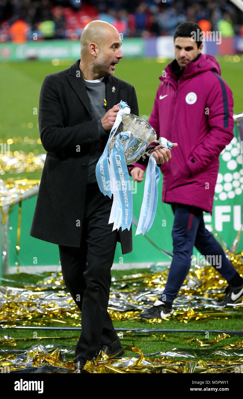 Manchester City manager Pep Guardiola celebrates with the trophy during ...