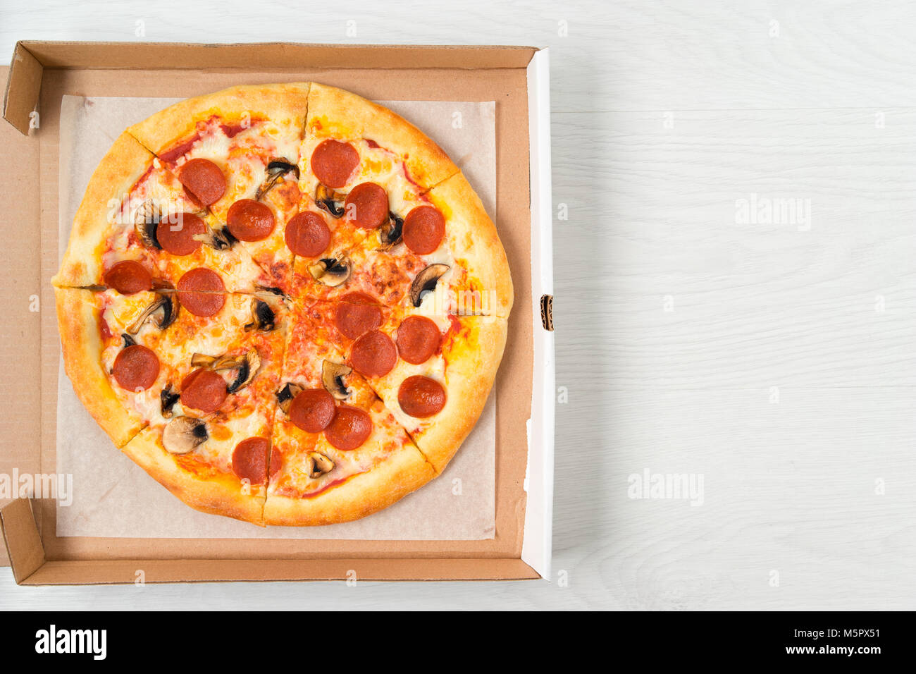 Pepperoni Pizza in a box close-up Stock Photo - Alamy