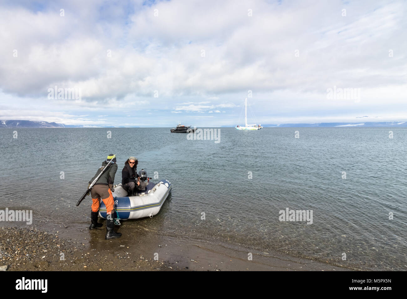 Svalbard, Norway, August 3, 2017: Two guides from Better Moments ...