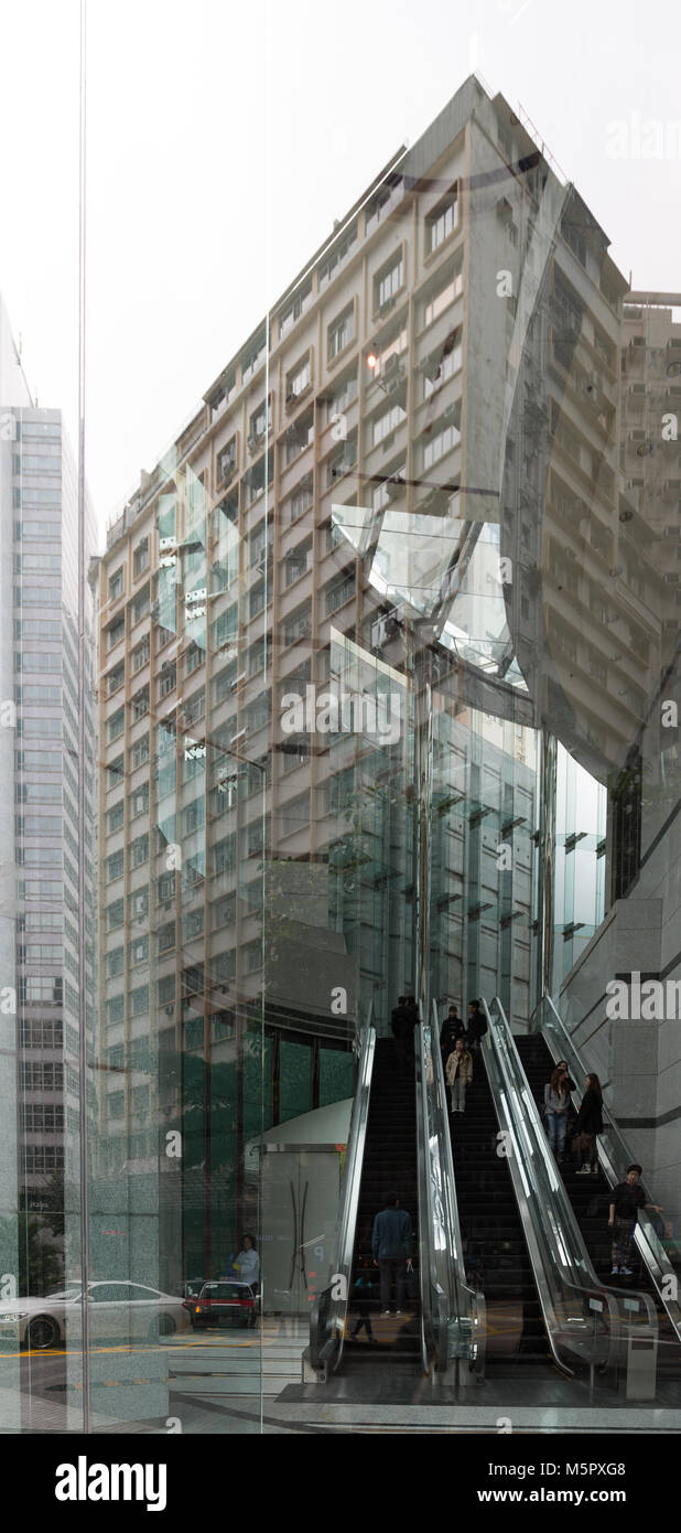 Reflections of escalator inside glass building - not retouched Stock ...