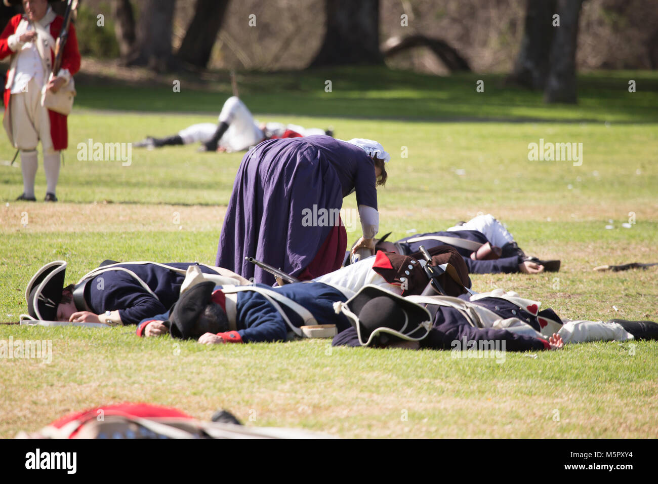 A woman cares and checks dead and injured American soldiers during a ...
