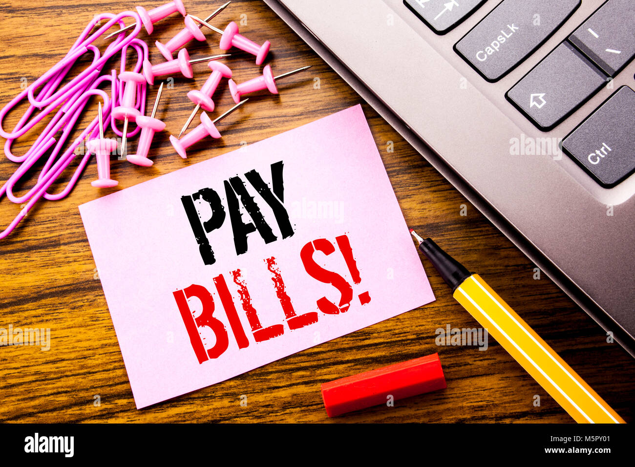 Handwritten text showing Pay Bills. Business concept for Finance Paying ...