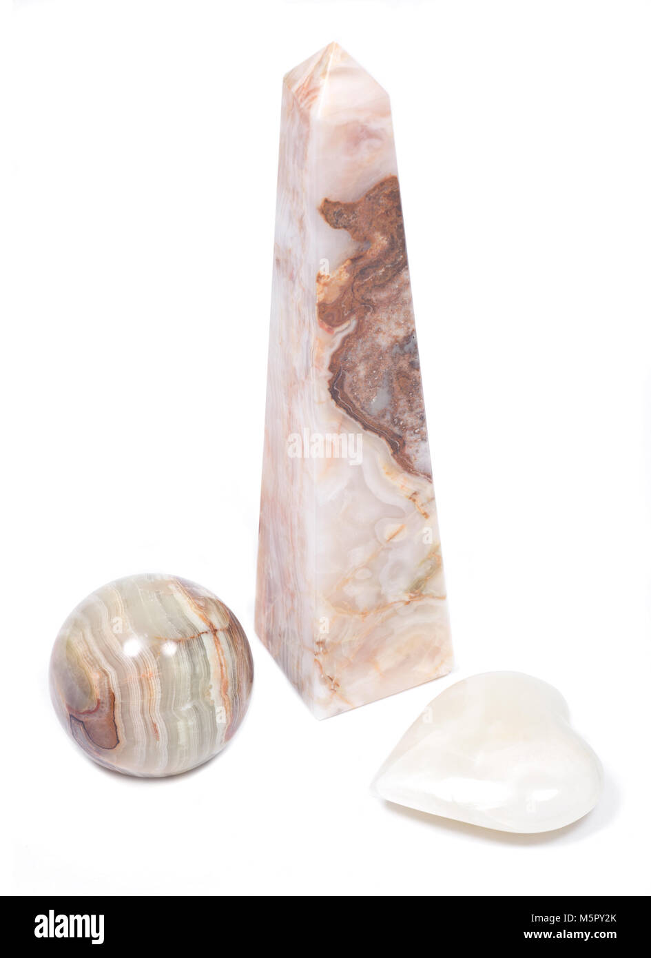 Polished multicolor onyx carvings isolated on white background Stock ...