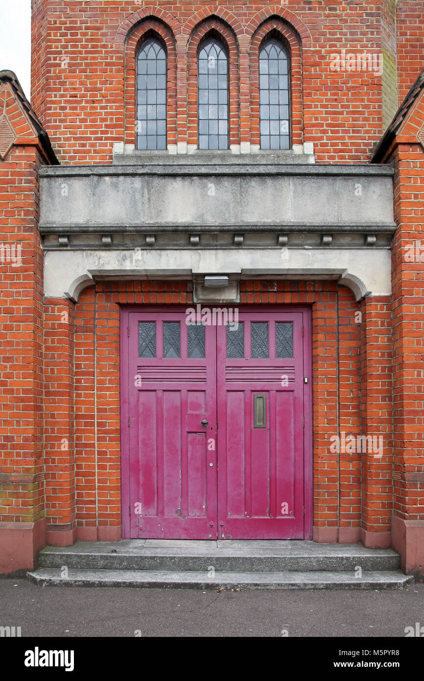 Big outside door on the building with brick wall facade Stock Photo - Alamy