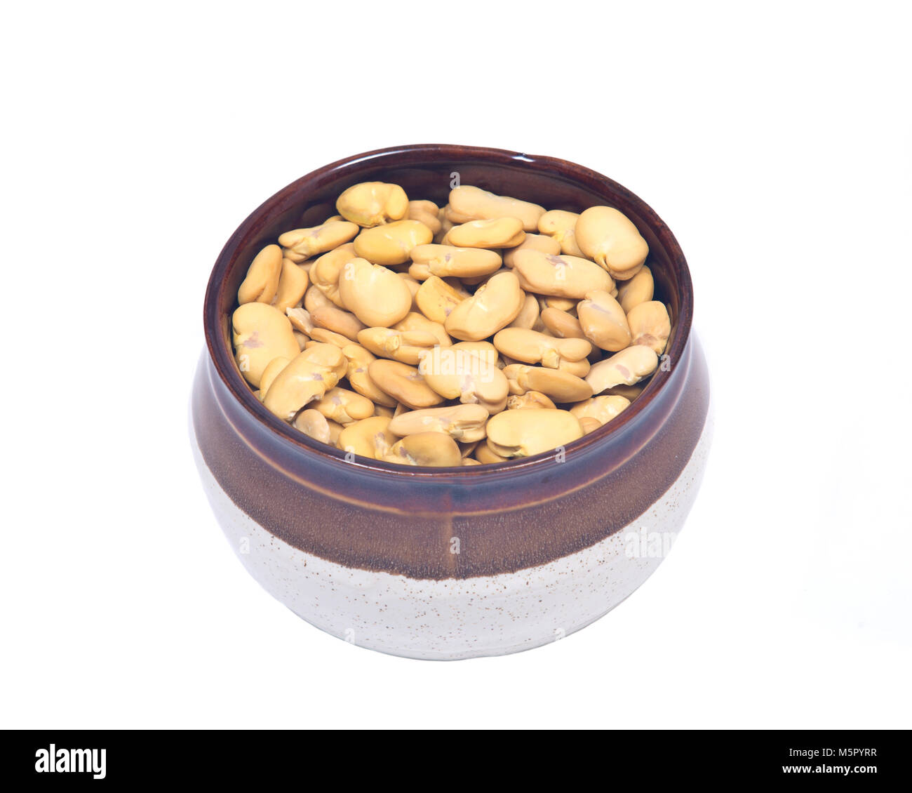 Organic dry broad haba beans in ceramic bowl isolated on white ...