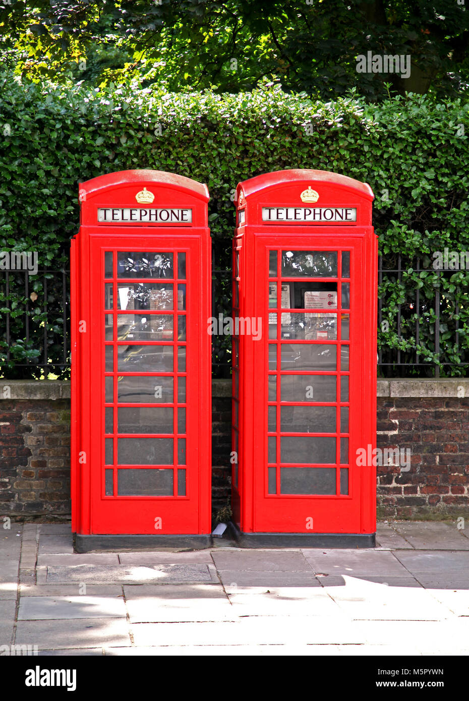 Famous British landmark red phonebooth on London street Stock Photo - Alamy