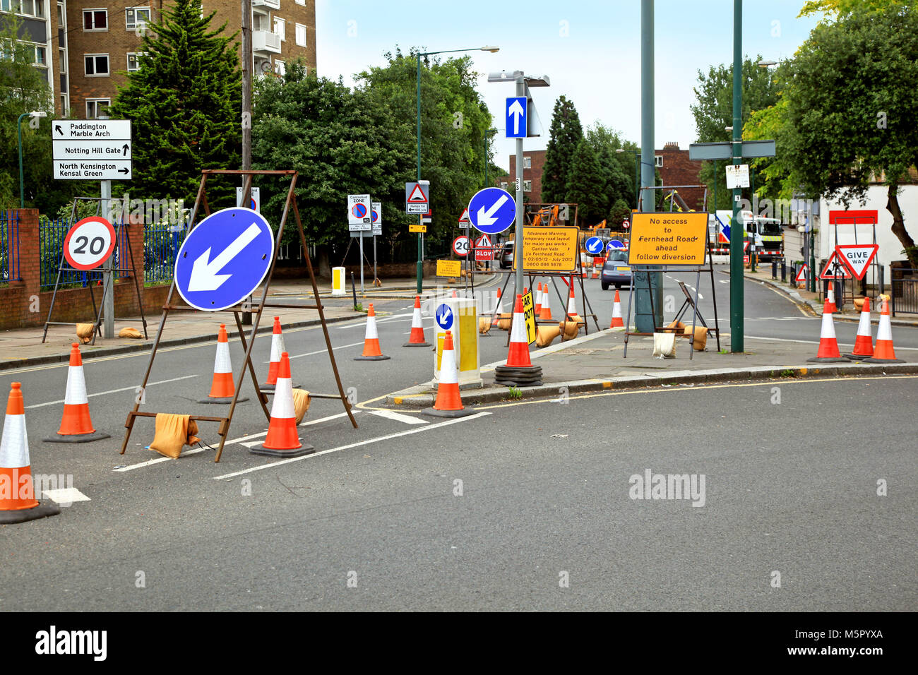 Bunch of traffic signes on street signaling road works Stock Photo - Alamy