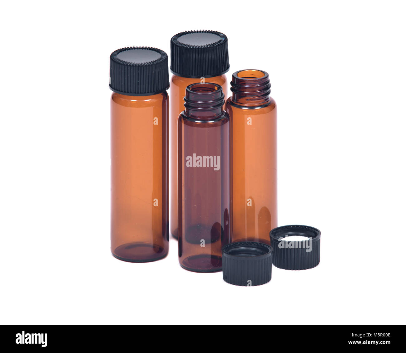 Brown travel medicine vials with caps isolated on white background ...