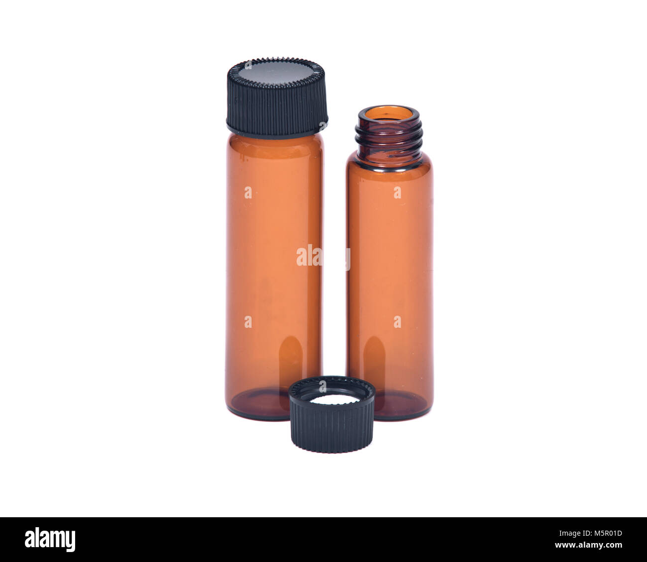 Brown travel medicine vials with caps isolated on white background ...