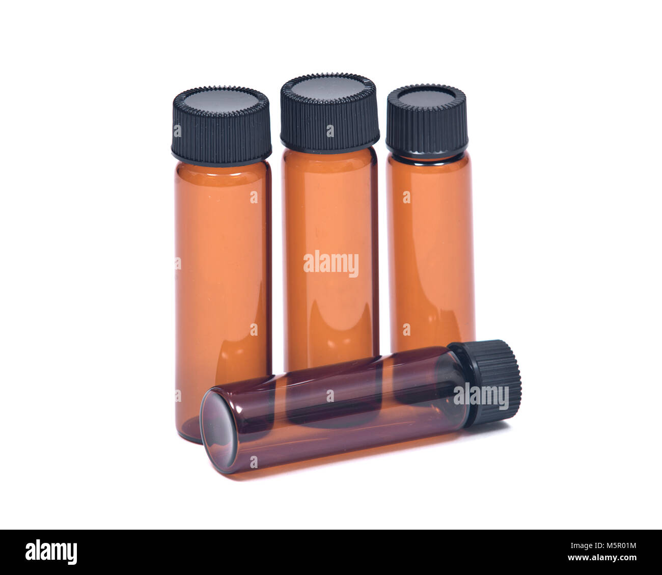 Brown travel medicine vials with caps isolated on white background ...