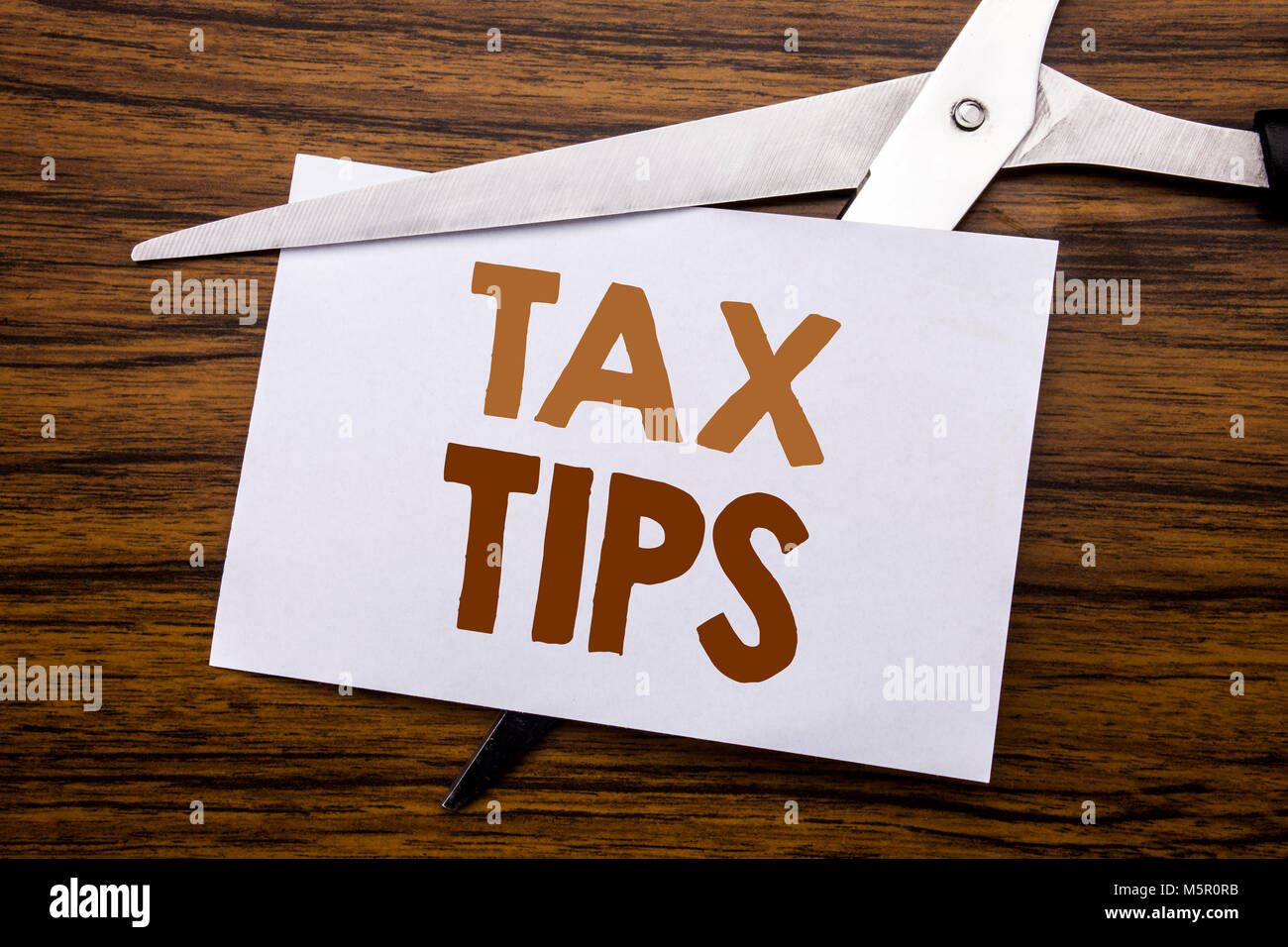 Hand writing text caption inspiration showing Tax Tips. Business ...