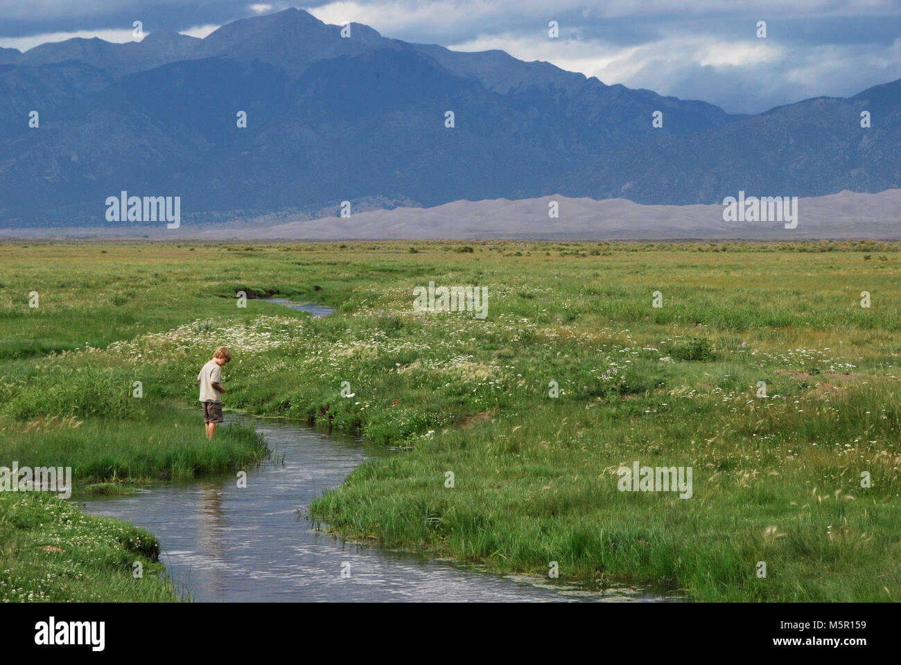 Boy Next to Big Spring Creek Stock Photo - Alamy
