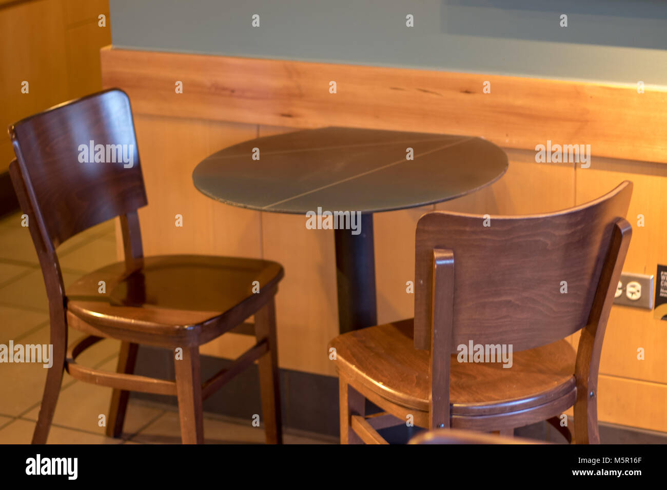 Table and chairs in coffee shop Stock Photo - Alamy
