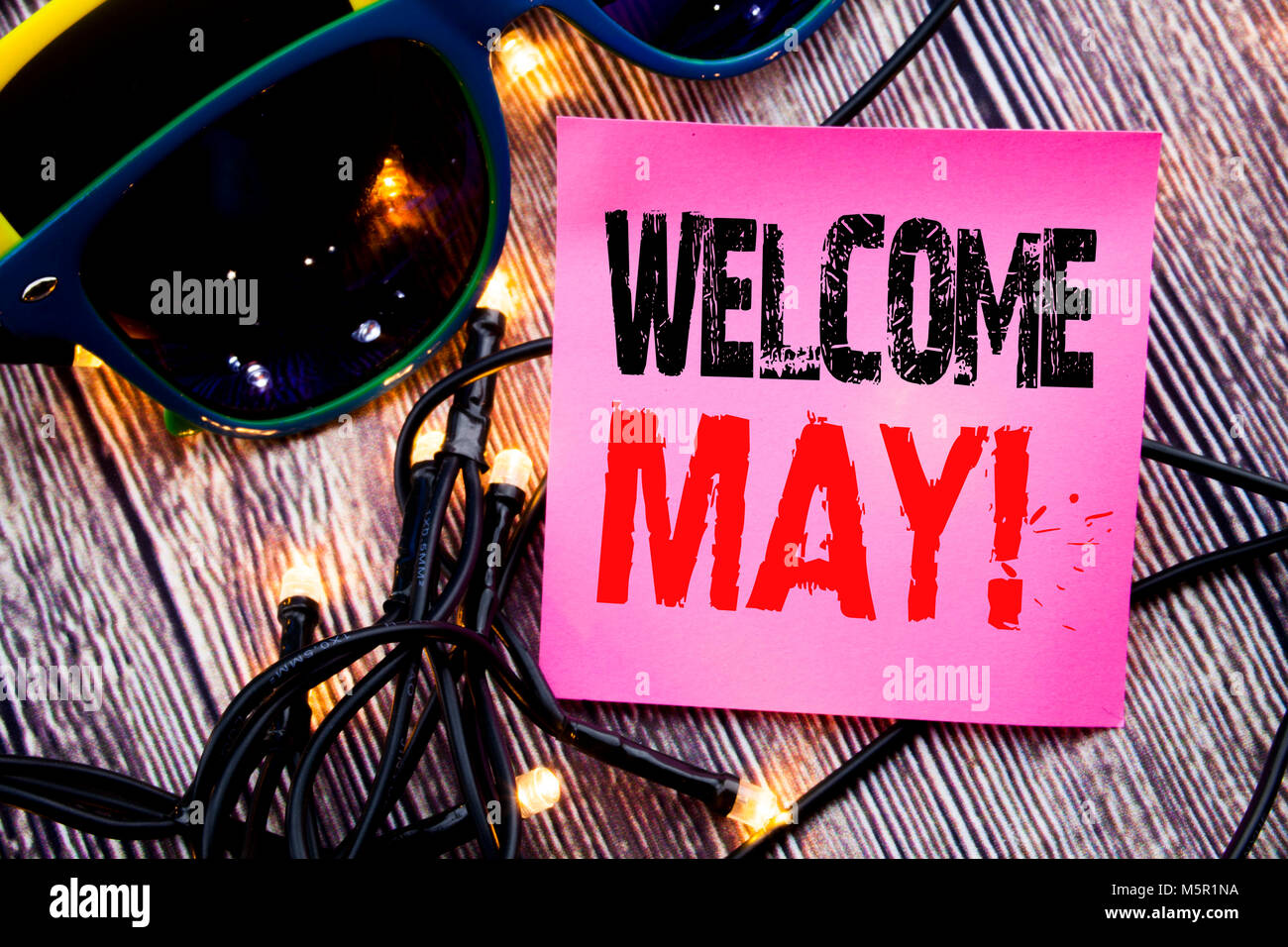 Hand writing text caption showing Welcome May. Business concept for ...