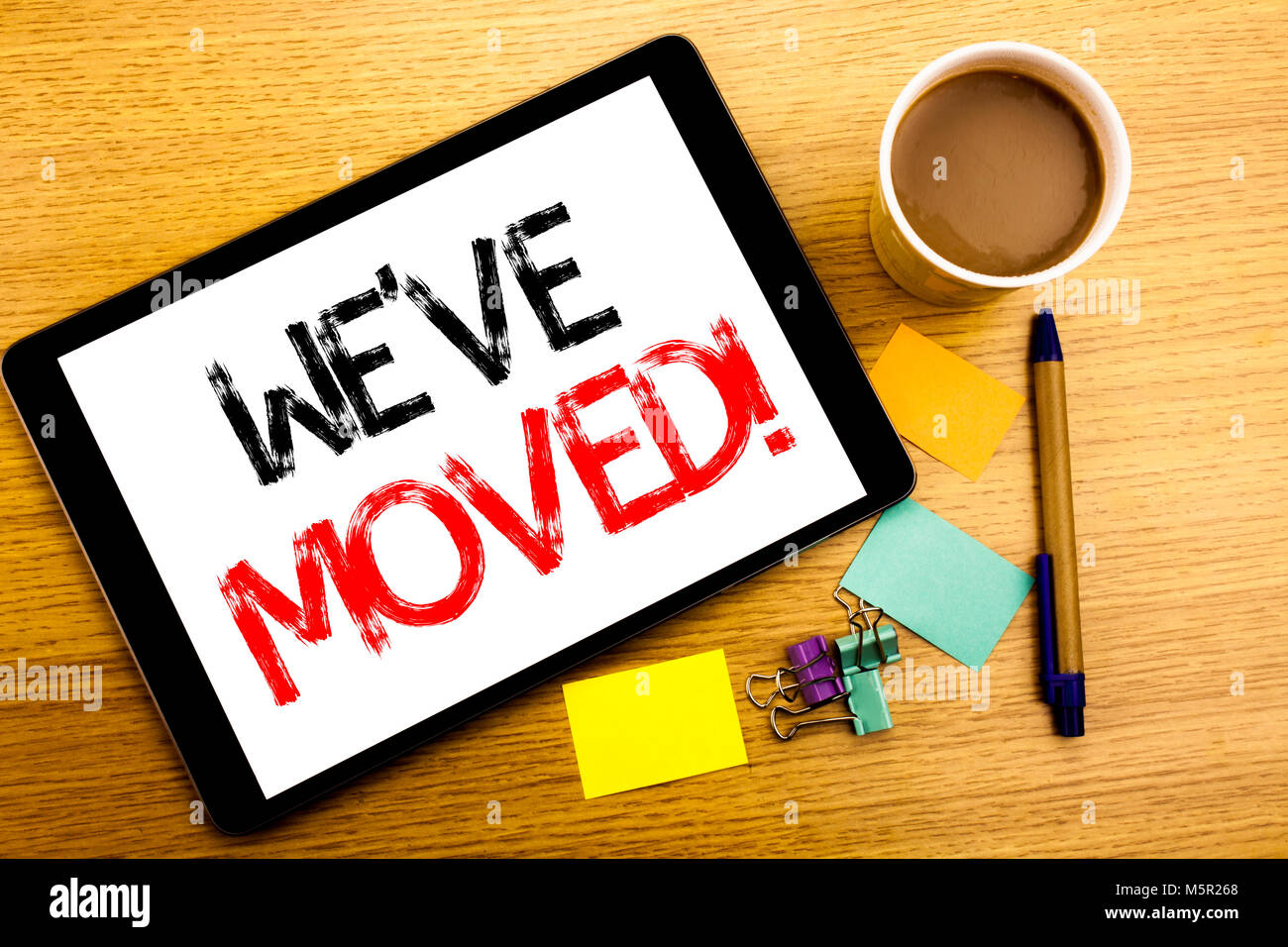 Handwritten text caption showing We Have Moved. Business concept ...