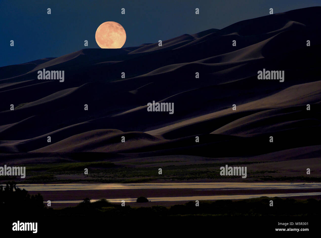 Full Moon over Dunes and Medano Creek Stock Photo - Alamy