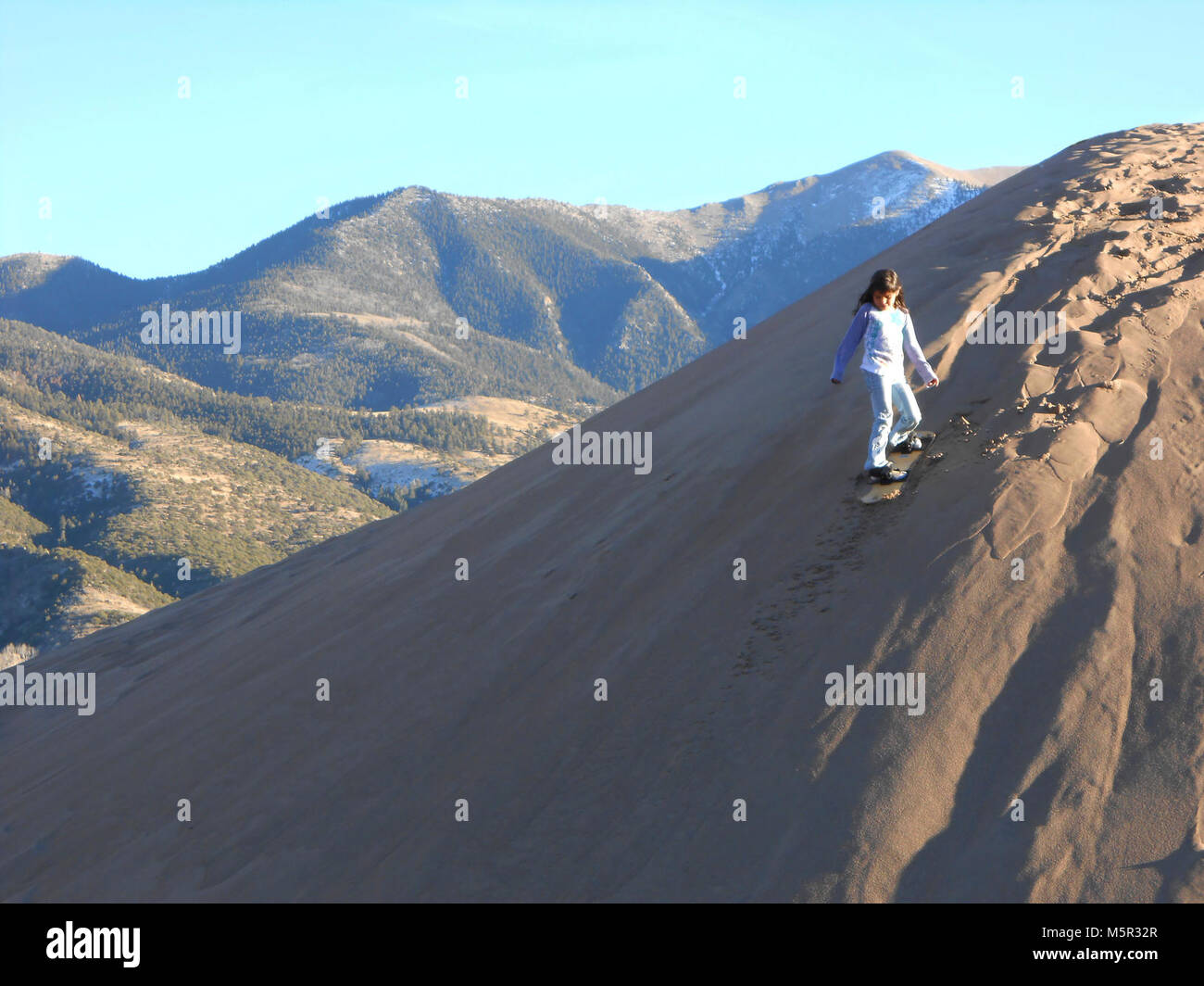 Girl Sandboarding Stock Photo - Alamy