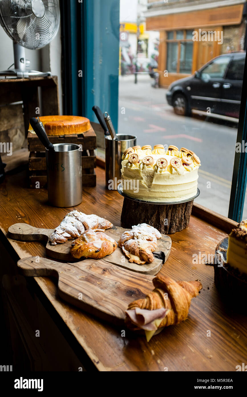 pastry shop window seen from the inside Stock Photo - Alamy