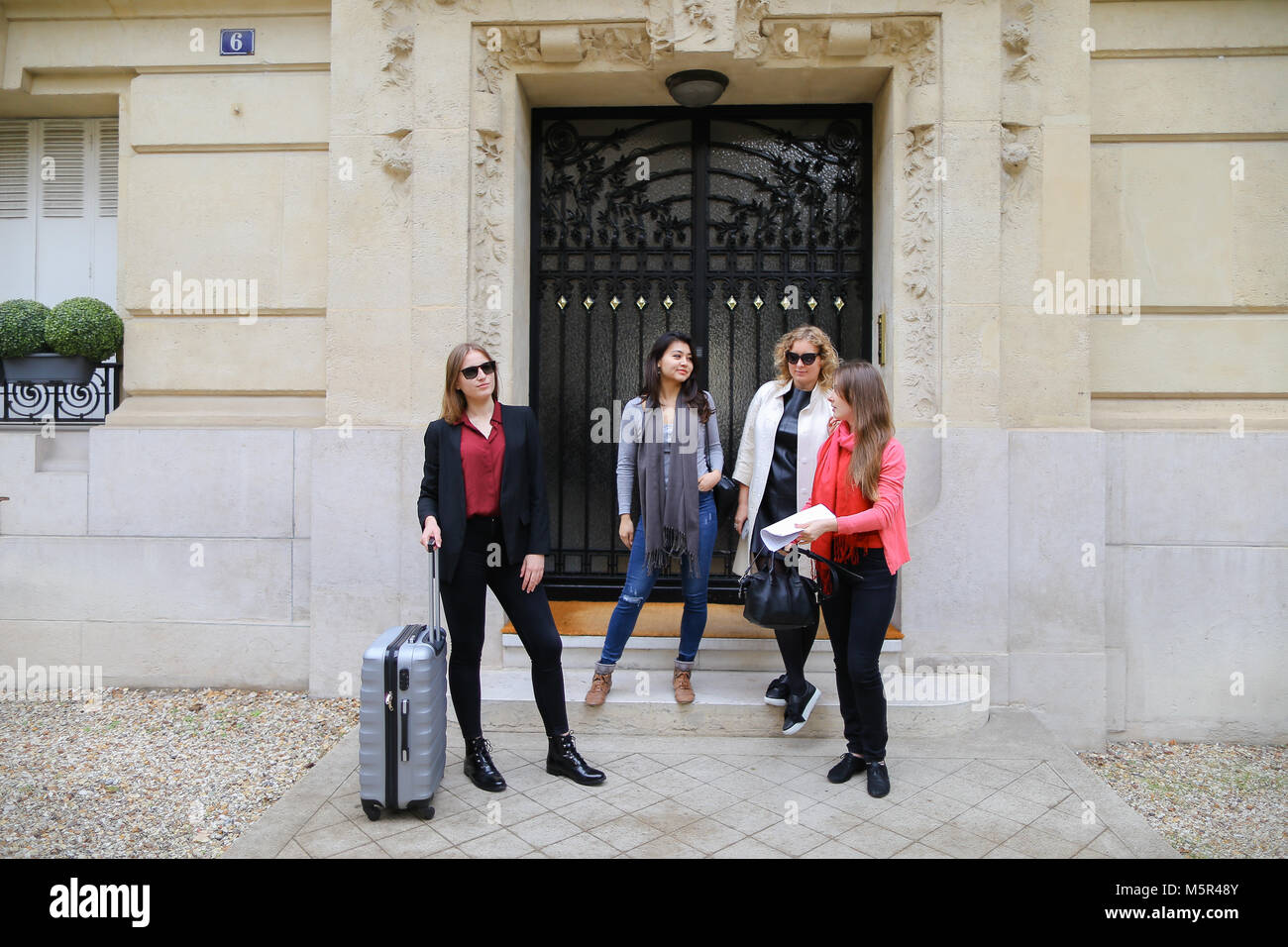 Happy students leaving university building in Stock Photo - Alamy