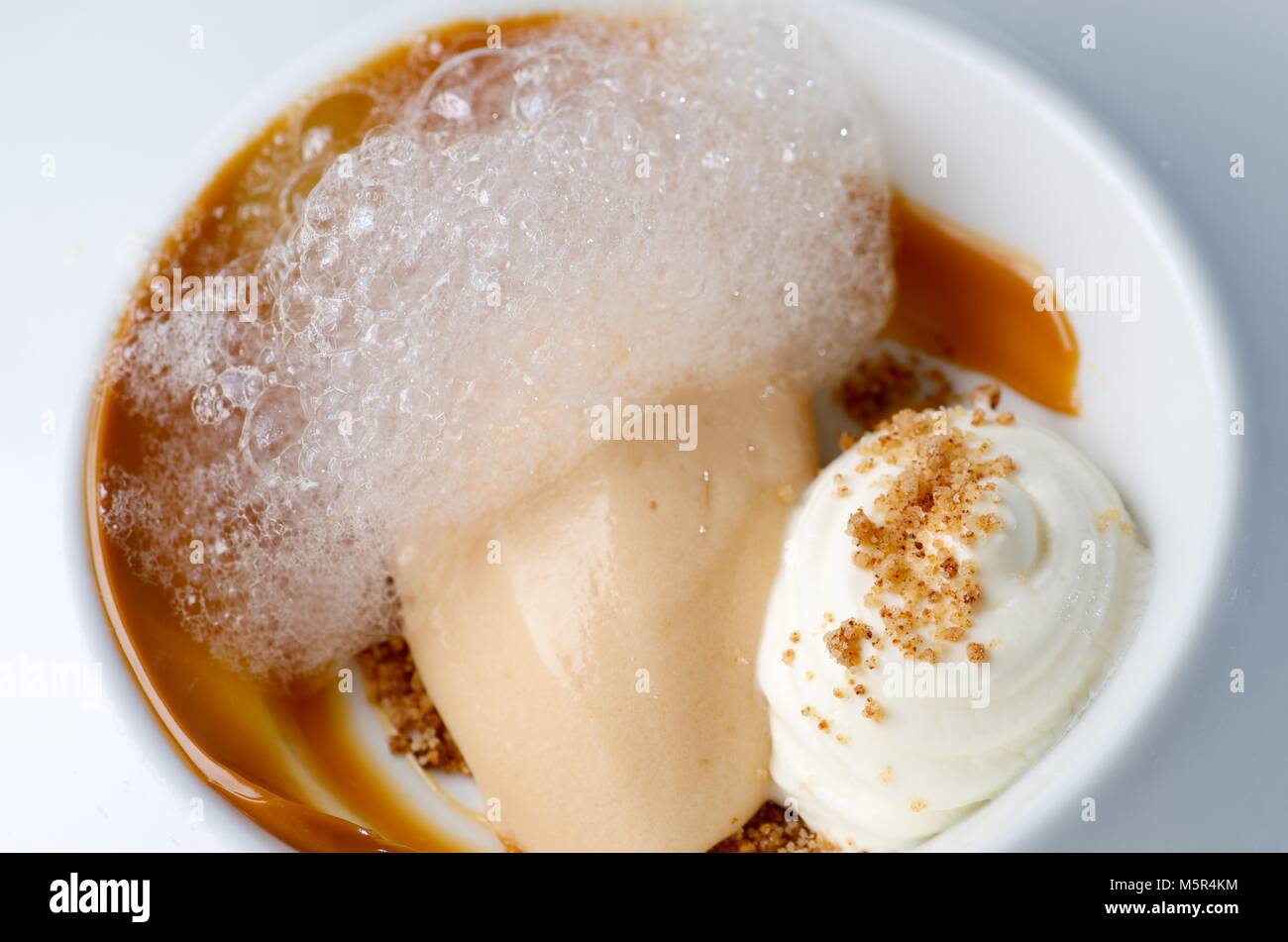 peach ice cream with caramel and shuffle Stock Photo - Alamy