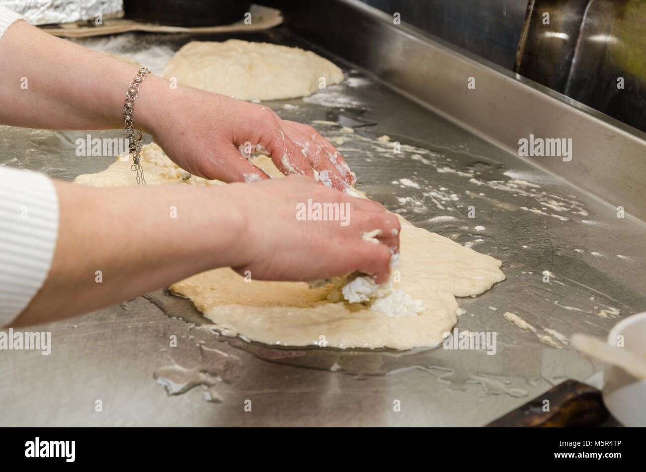 Women are making pies on the kitchen counter. women hands Stock Photo ...